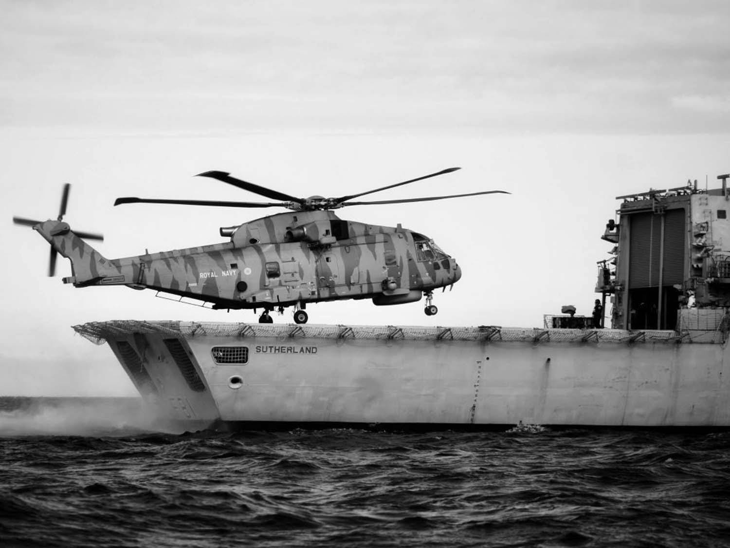 HMS Sutherland and her Merlin helicopter hunt British submarine